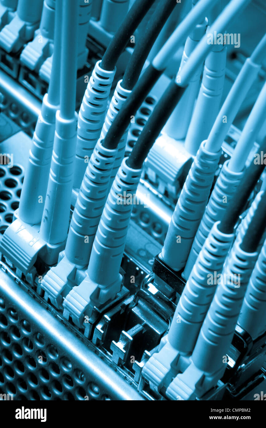 optic fiber cables connected to hub Stock Photo - Alamy