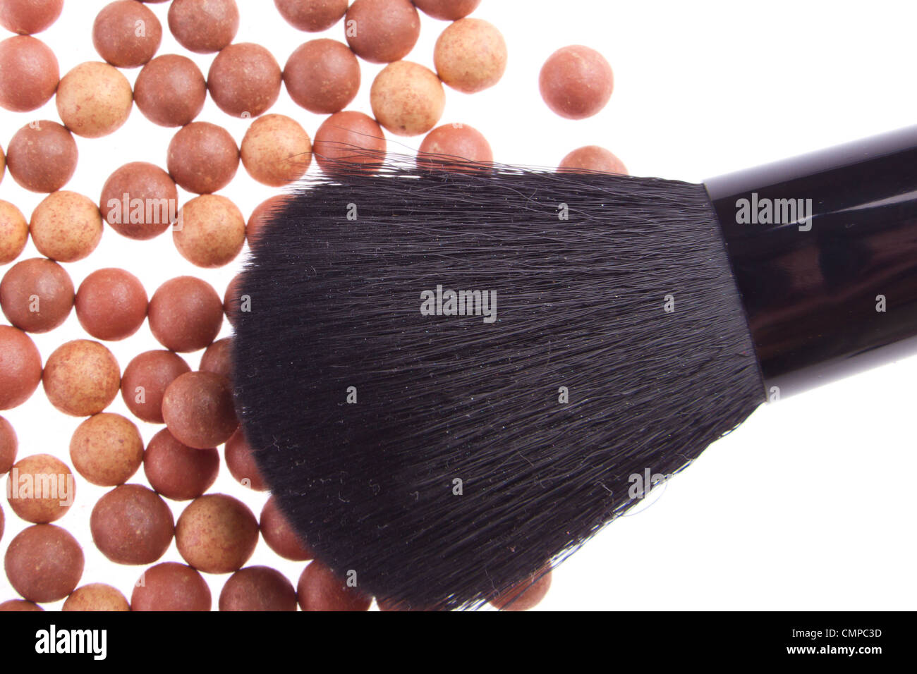bronzing pearls isolated on white background Stock Photo - Alamy