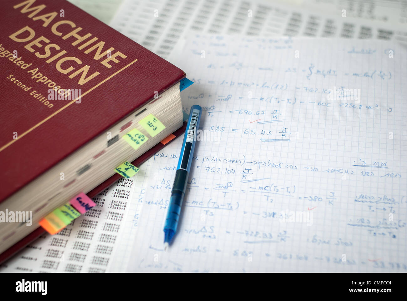 mathematical engineering studies with books and equations, machine ...