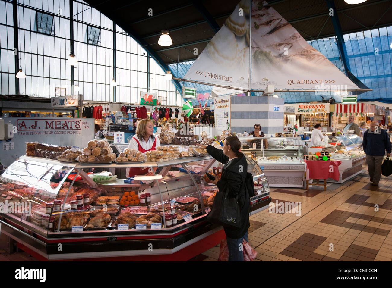 UK, Wales, Swansea, Quadrant shopping centre, Indoor Market shopper at ...