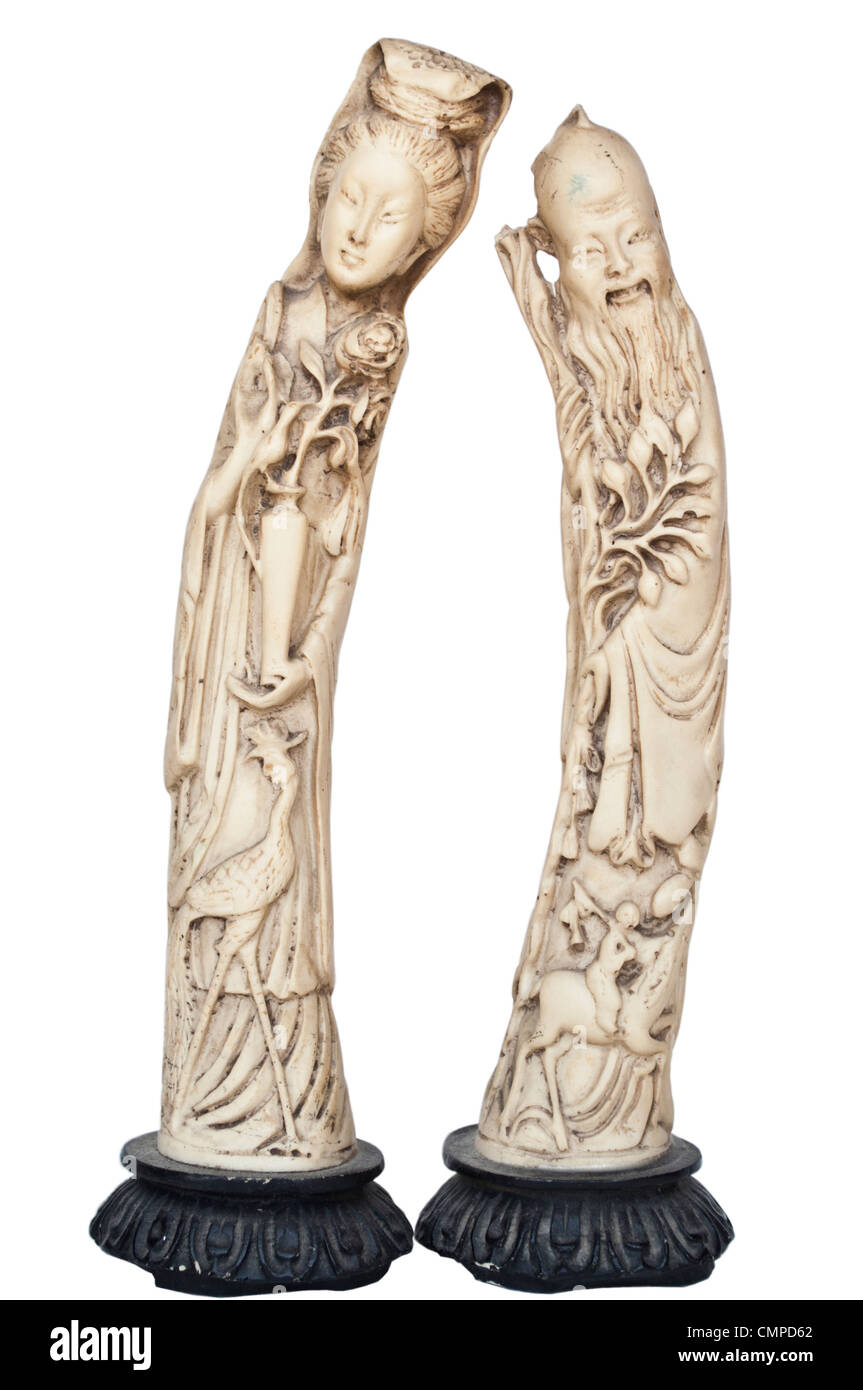Pair of Asian statues isolated on white Stock Photo - Alamy