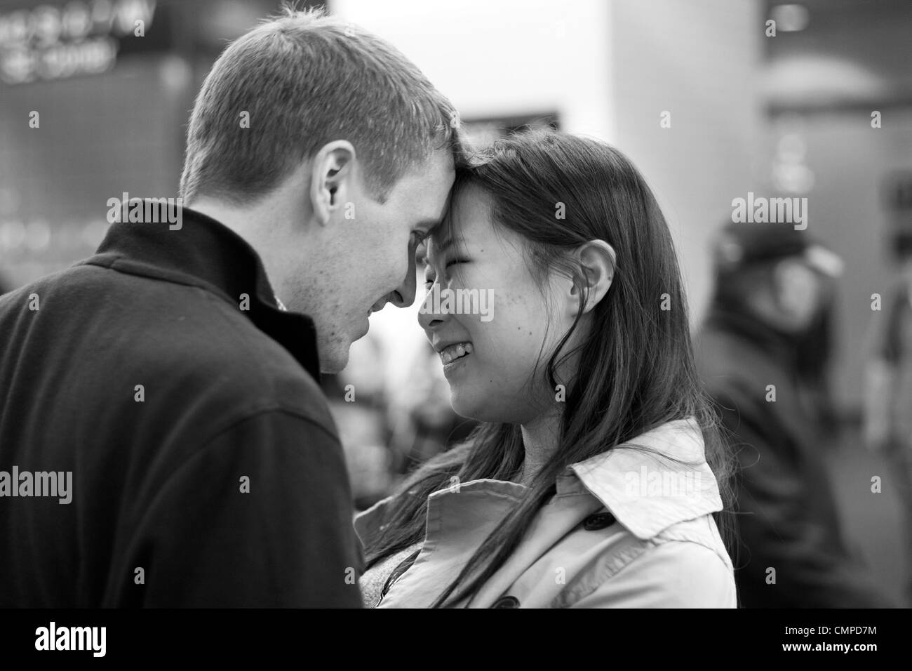 A couple express their affection for each other in a subway station in ...