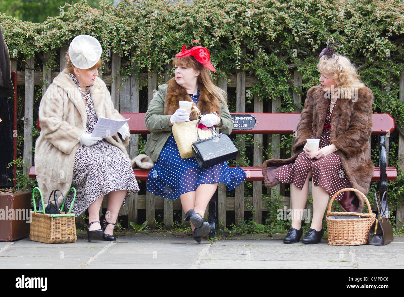 three old ladies sitting on a bench at a 1940's Wartime Weekend on the ...