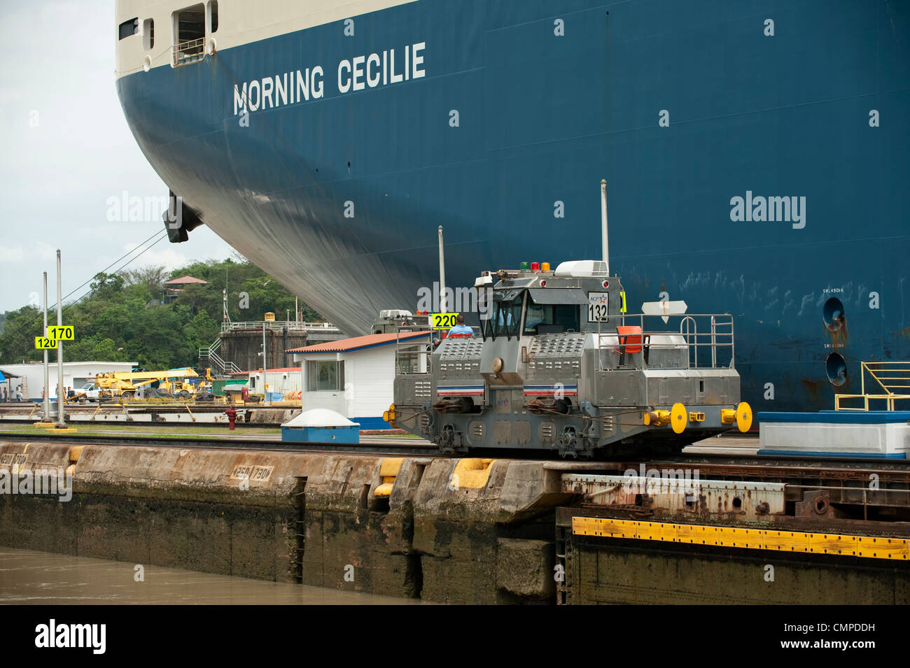 Locomotive and detail of stern of cargo ship at Miraflores locks ...