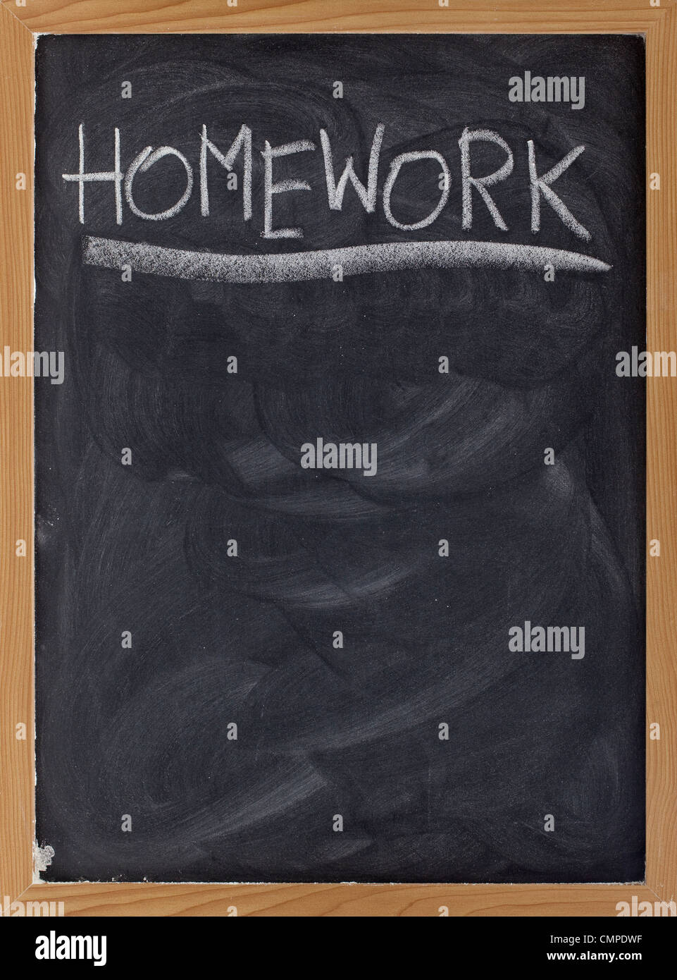 homework word handwritten with white chalk on blackboard with strong ...