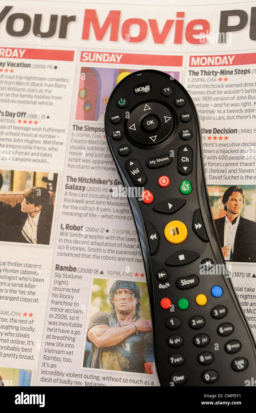 satellite television remote control and tv magazine england uk Stock ...