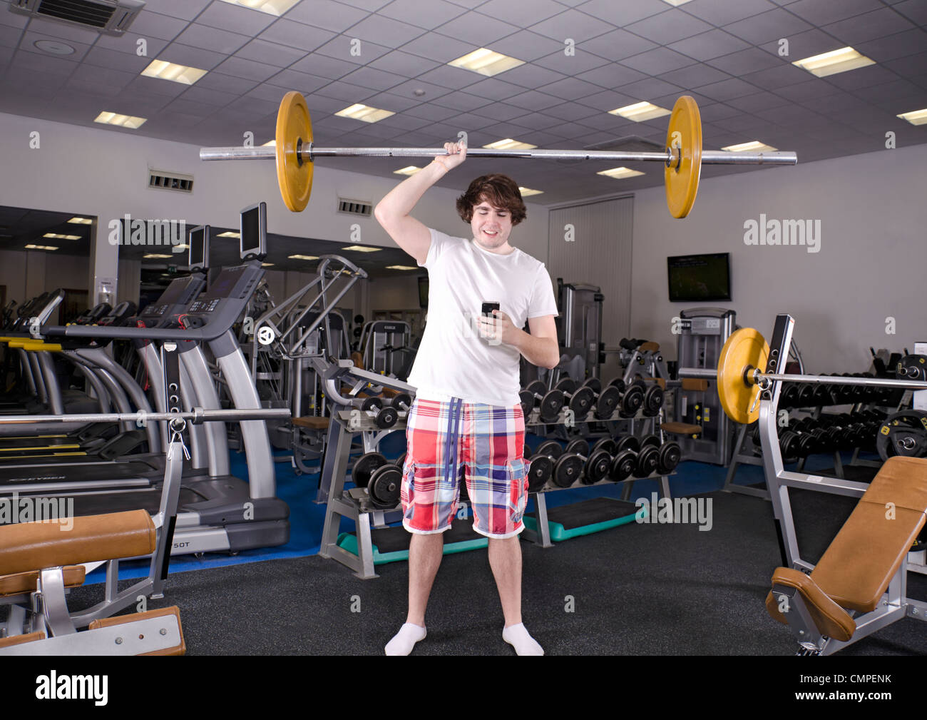 Texting at the Gym Stock Photo - Alamy