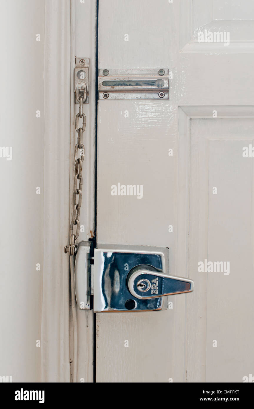 Home security a lock and door chain Stock Photo - Alamy