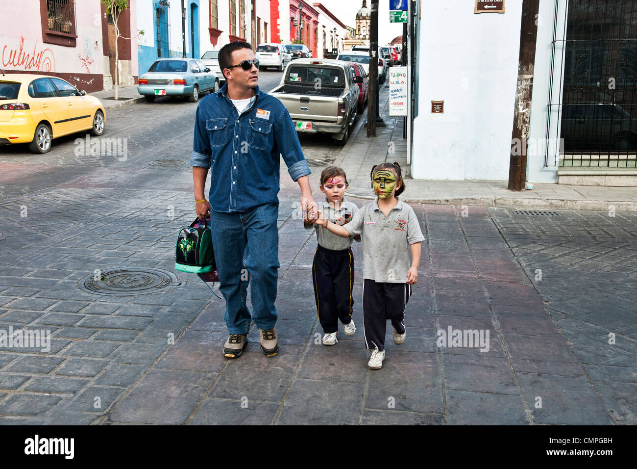 middle class Mexican dad father crossing street with his 2 little ...