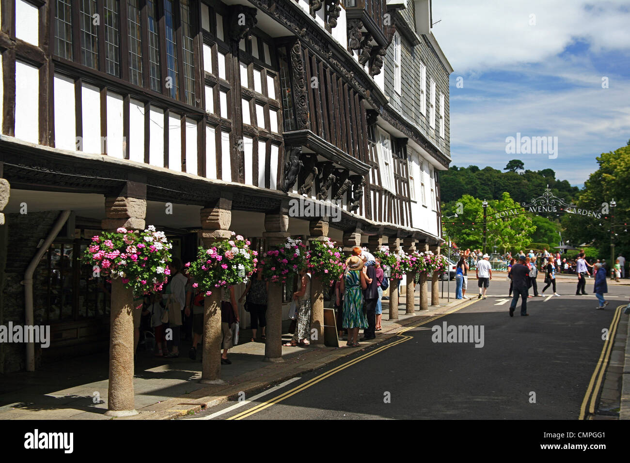 The historic Butterwalk arcade with its colourful hanging baskets in ...