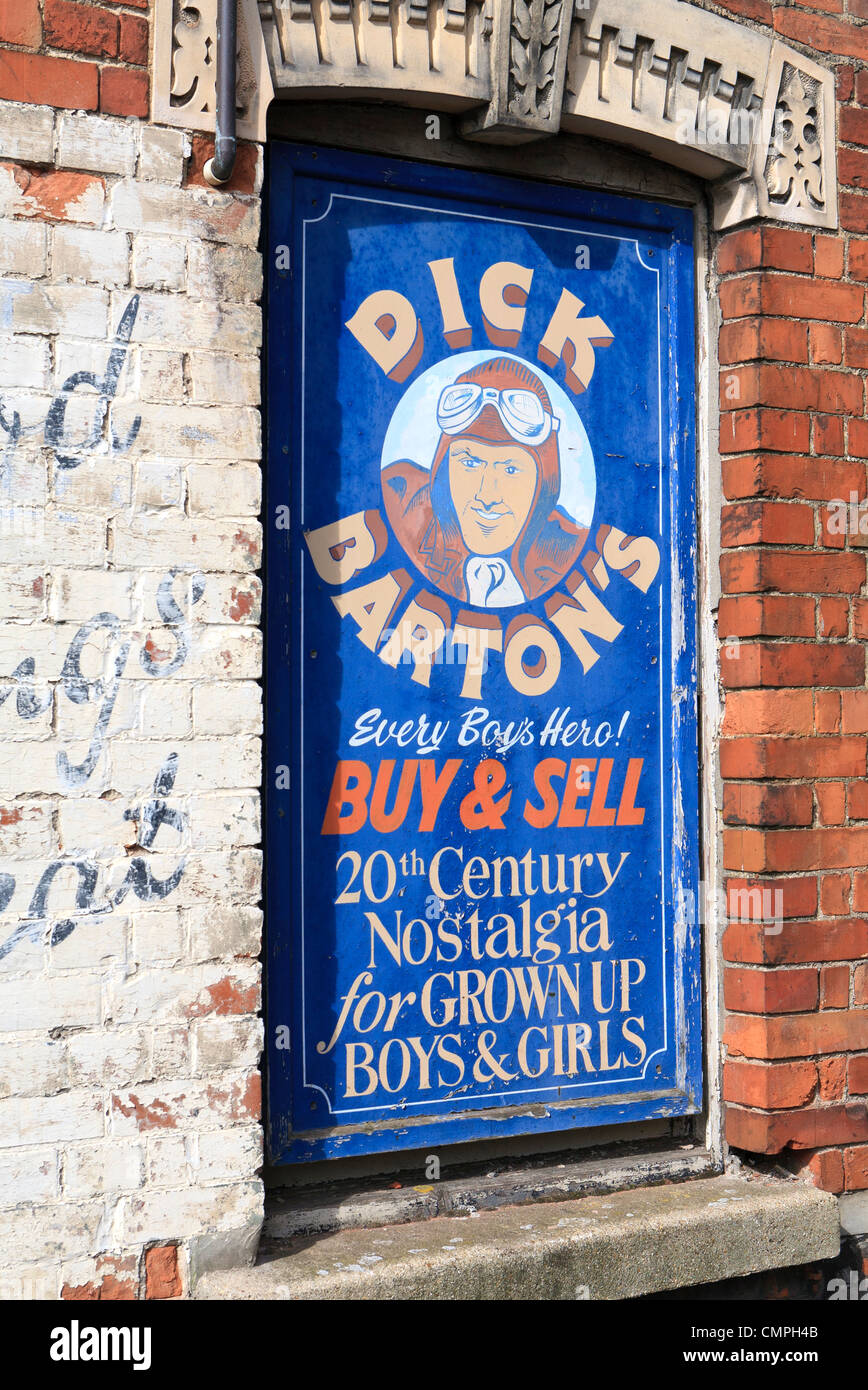 Old advertising sign for a local shop Stock Photo - Alamy