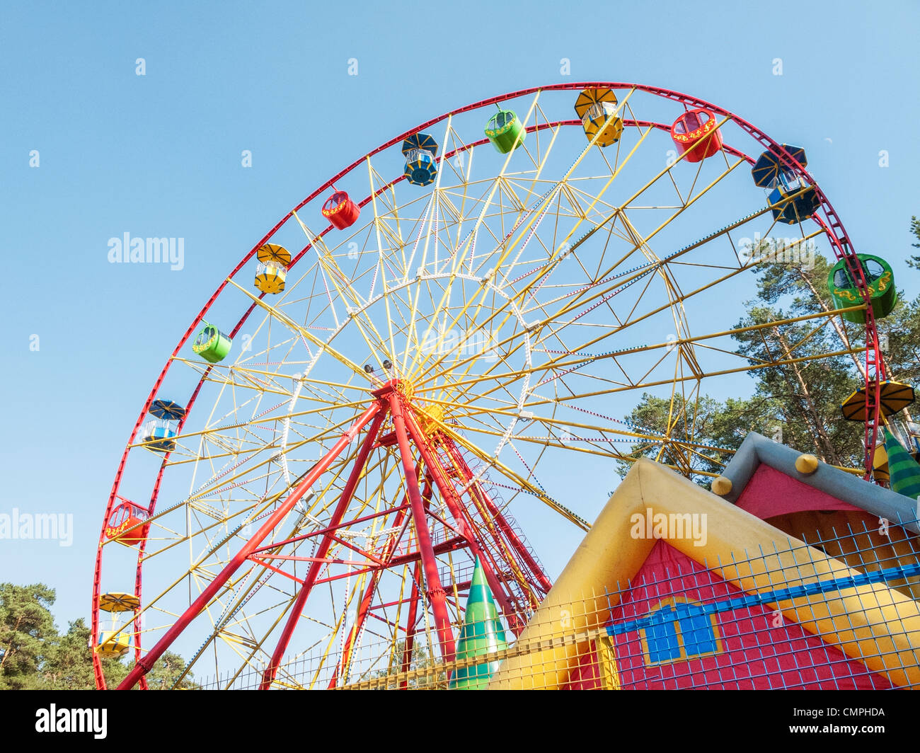 Brightly colored ferris wheel in a park in Perm, Russia Stock Photo - Alamy