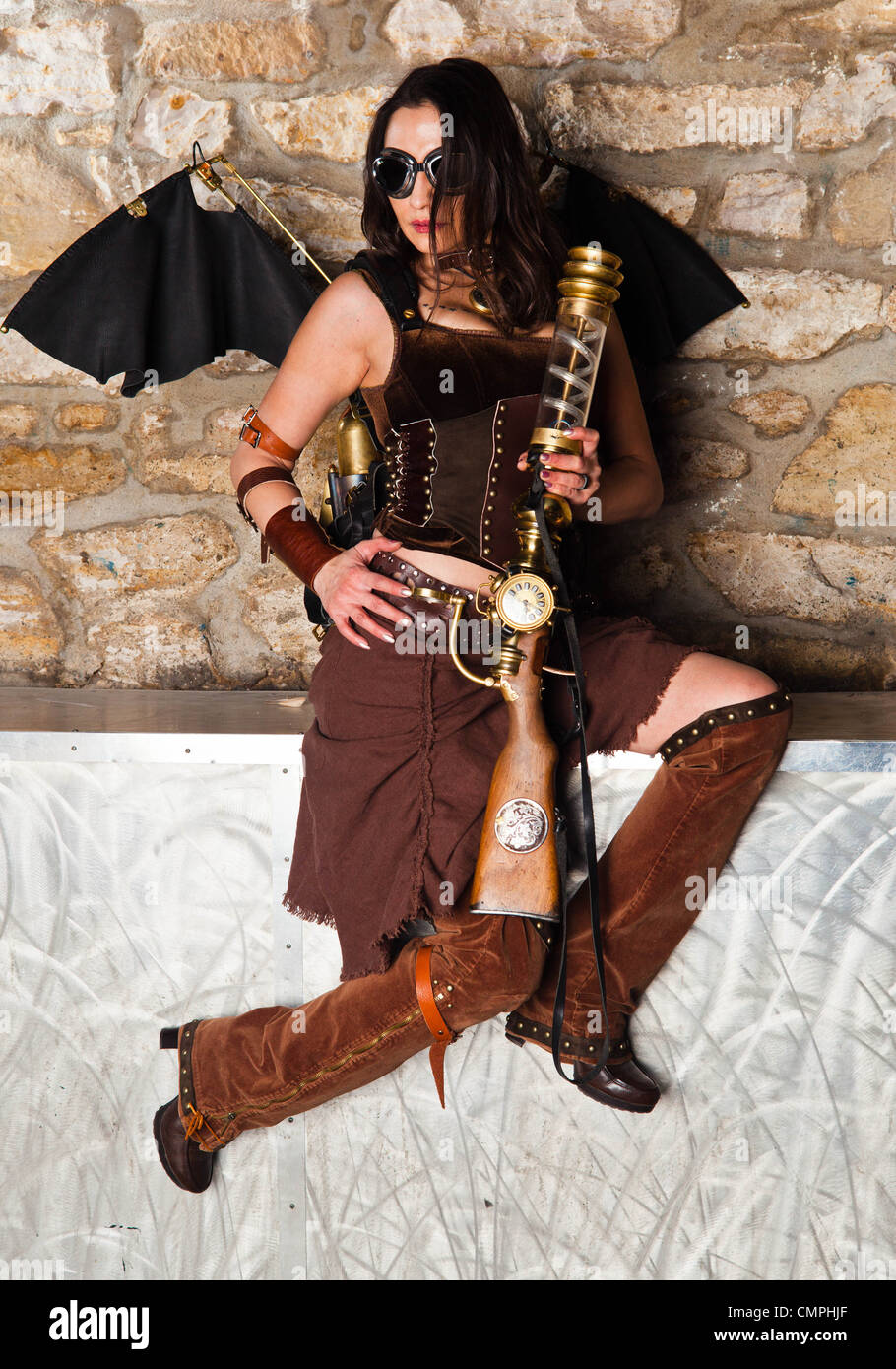A pinup girl dressed in Steampunk Themed attire with wings, a jet pack ...