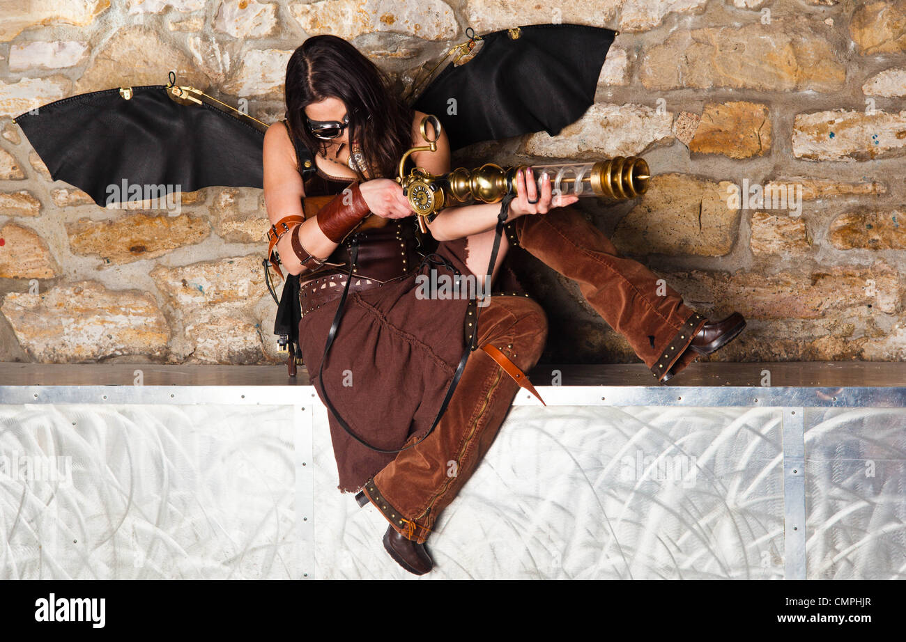 A pinup girl dressed in Steampunk Themed attire with wings, a jet pack ...