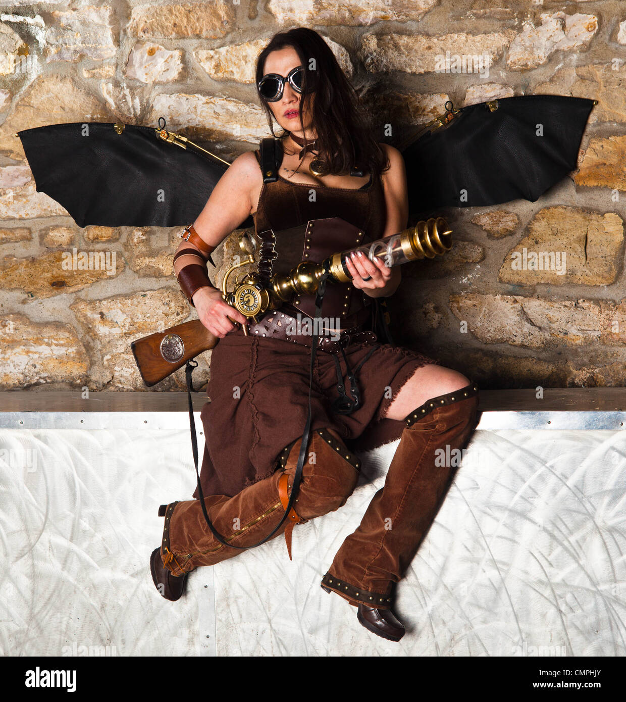 A pinup girl dressed in Steampunk Themed attire with wings, a jet pack ...