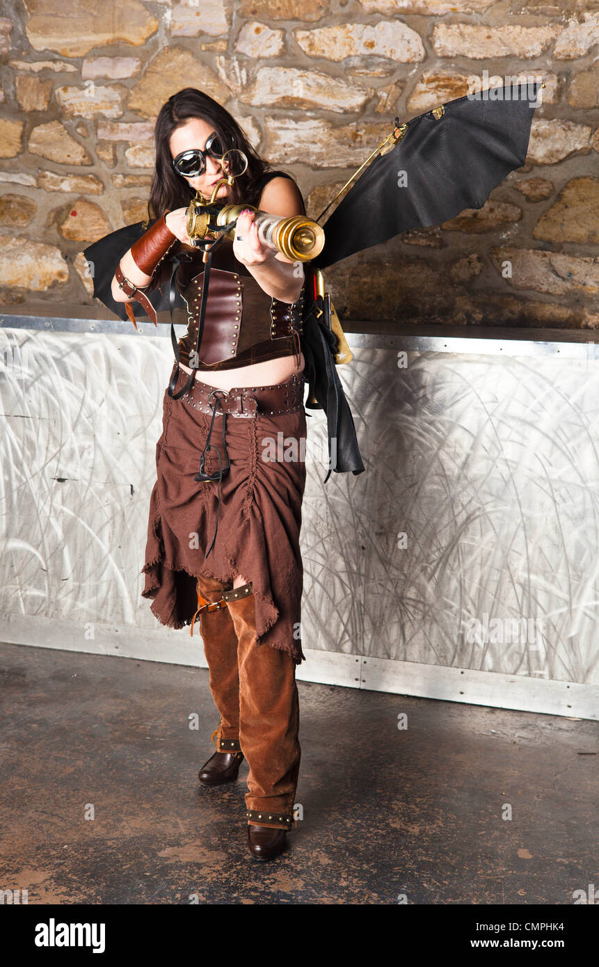 A pinup girl dressed in Steampunk Themed attire with wings, a jet pack ...