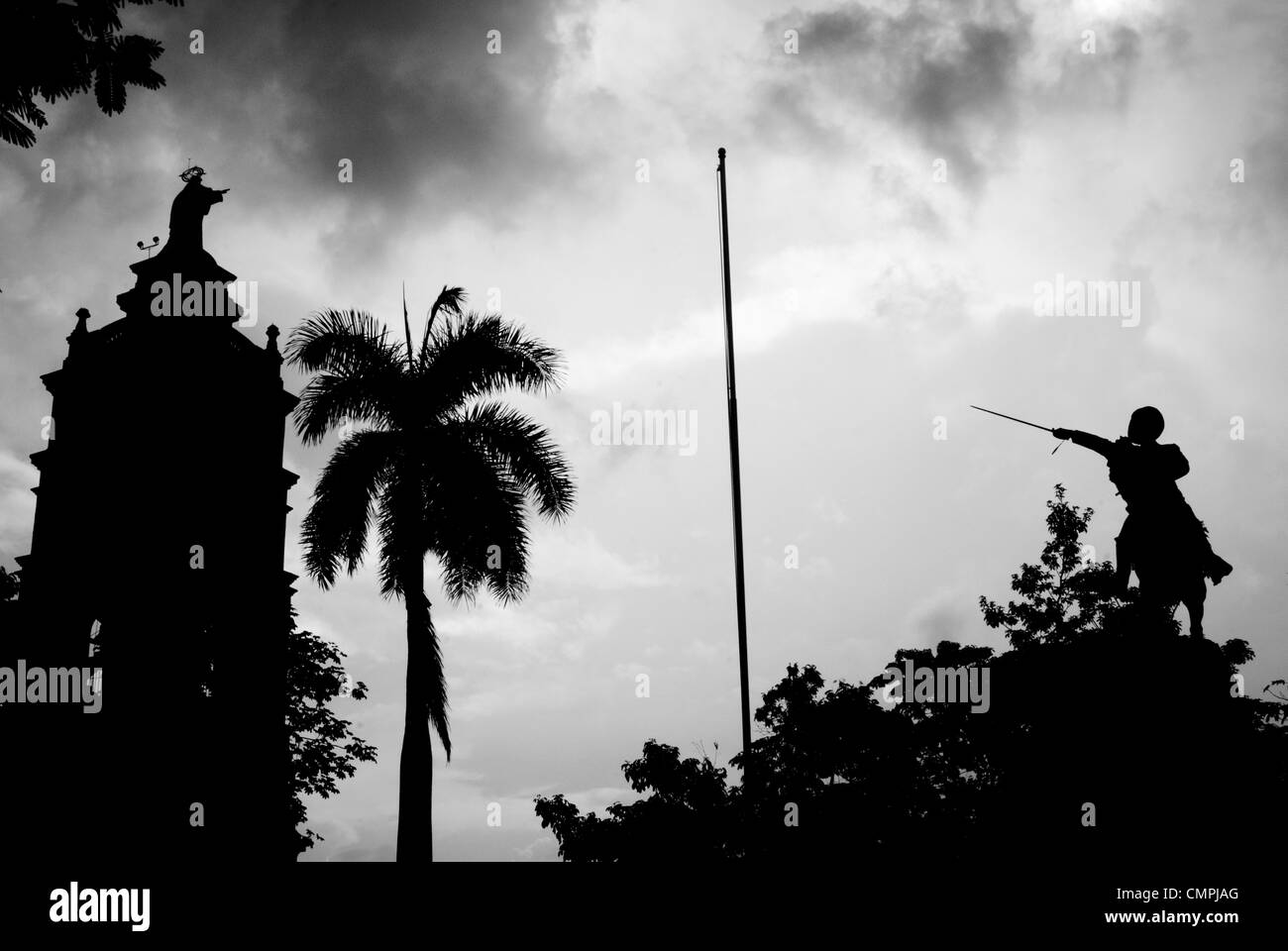 Silhouette of a monument of Ignacio Agramonte and a Cathedral Stock ...
