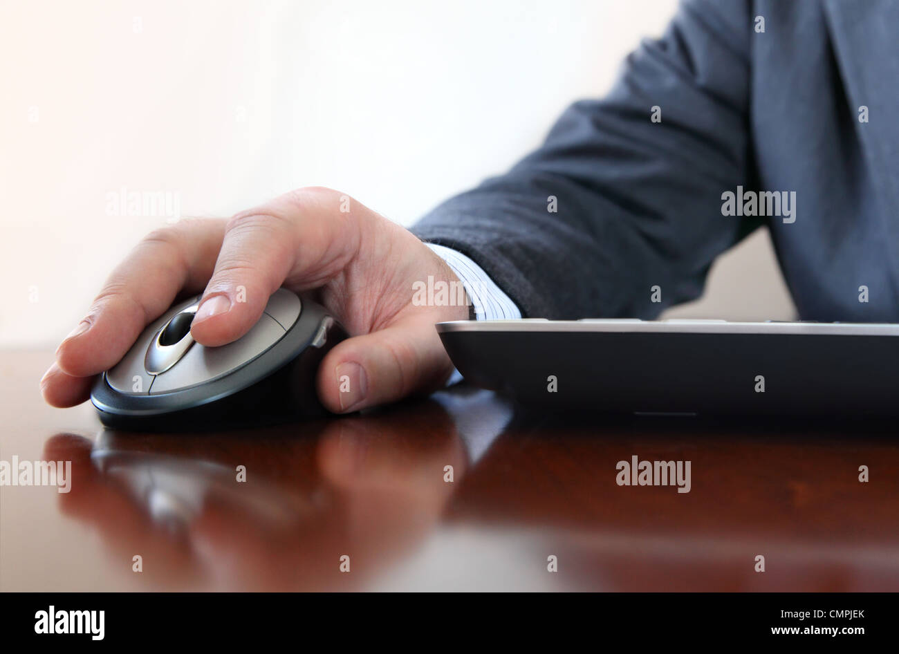 Male working on computer Stock Photo - Alamy