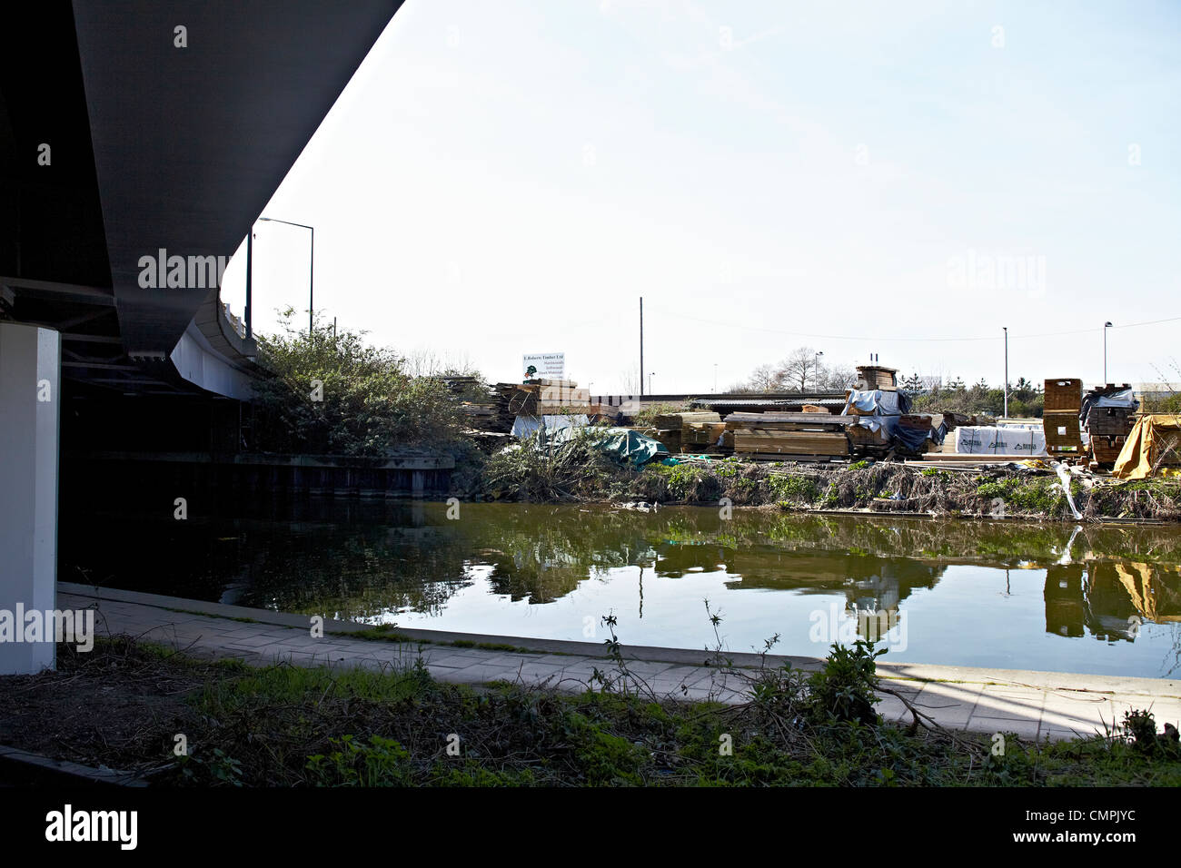 underneath a bridge near a canal on a sunny day Stock Photo - Alamy