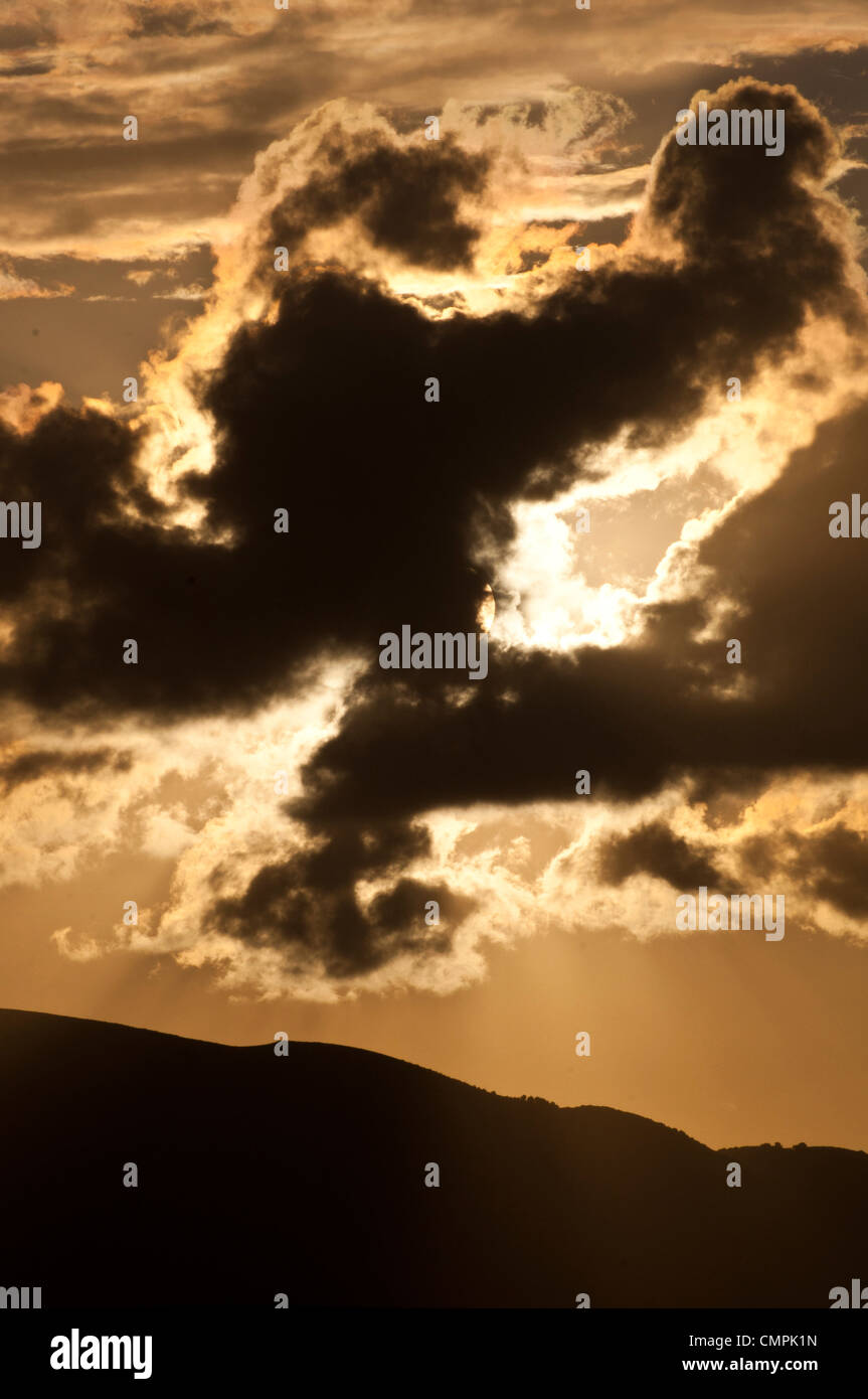 Dark clouds during sunset Stock Photo - Alamy