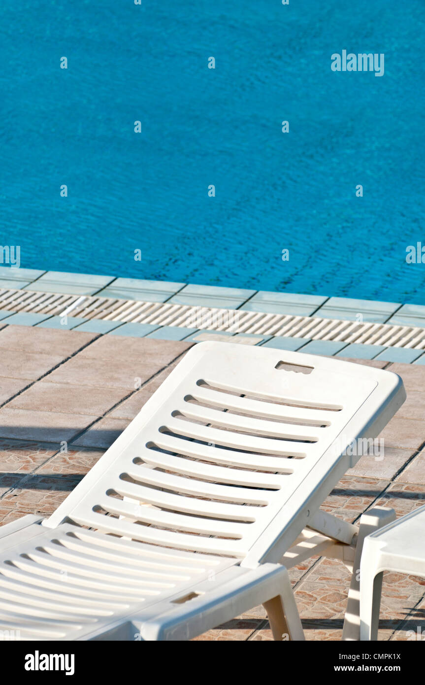 Swimming pool concept with sun bad and swimming pool Stock Photo - Alamy
