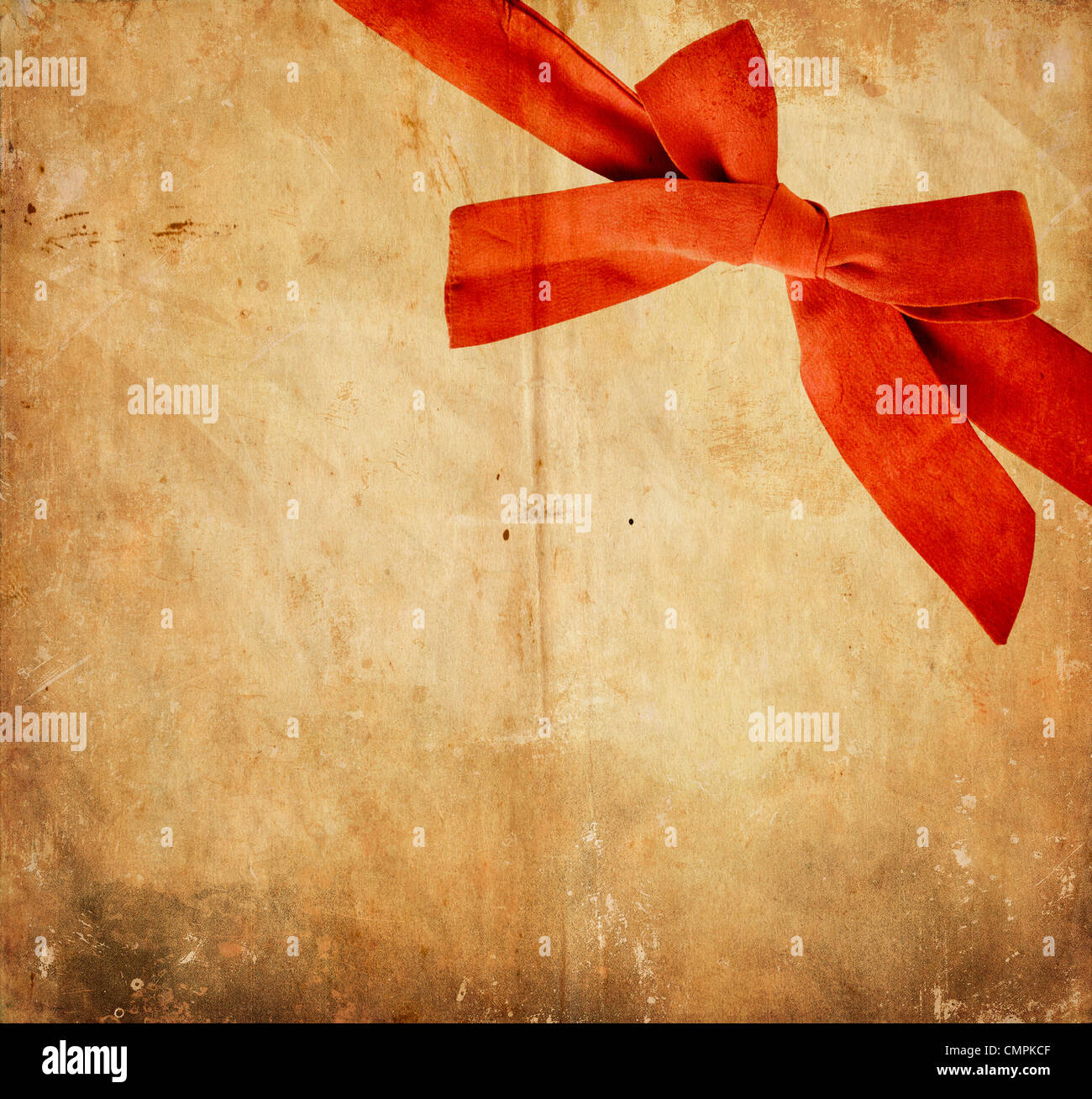 Vintage paper with red bow Stock Photo - Alamy