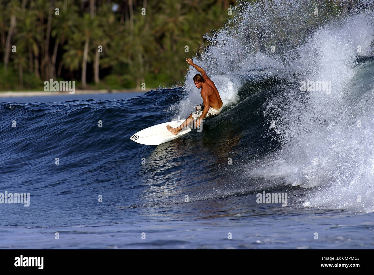 Surfing at Lagundri Bay on Nias Island, Sumatra, Indonesia Stock Photo ...