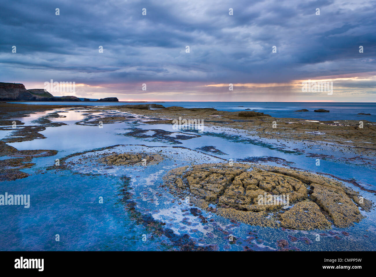 Rock formations on the shale shelf at Saltwick Bay, Yorkshire, England ...