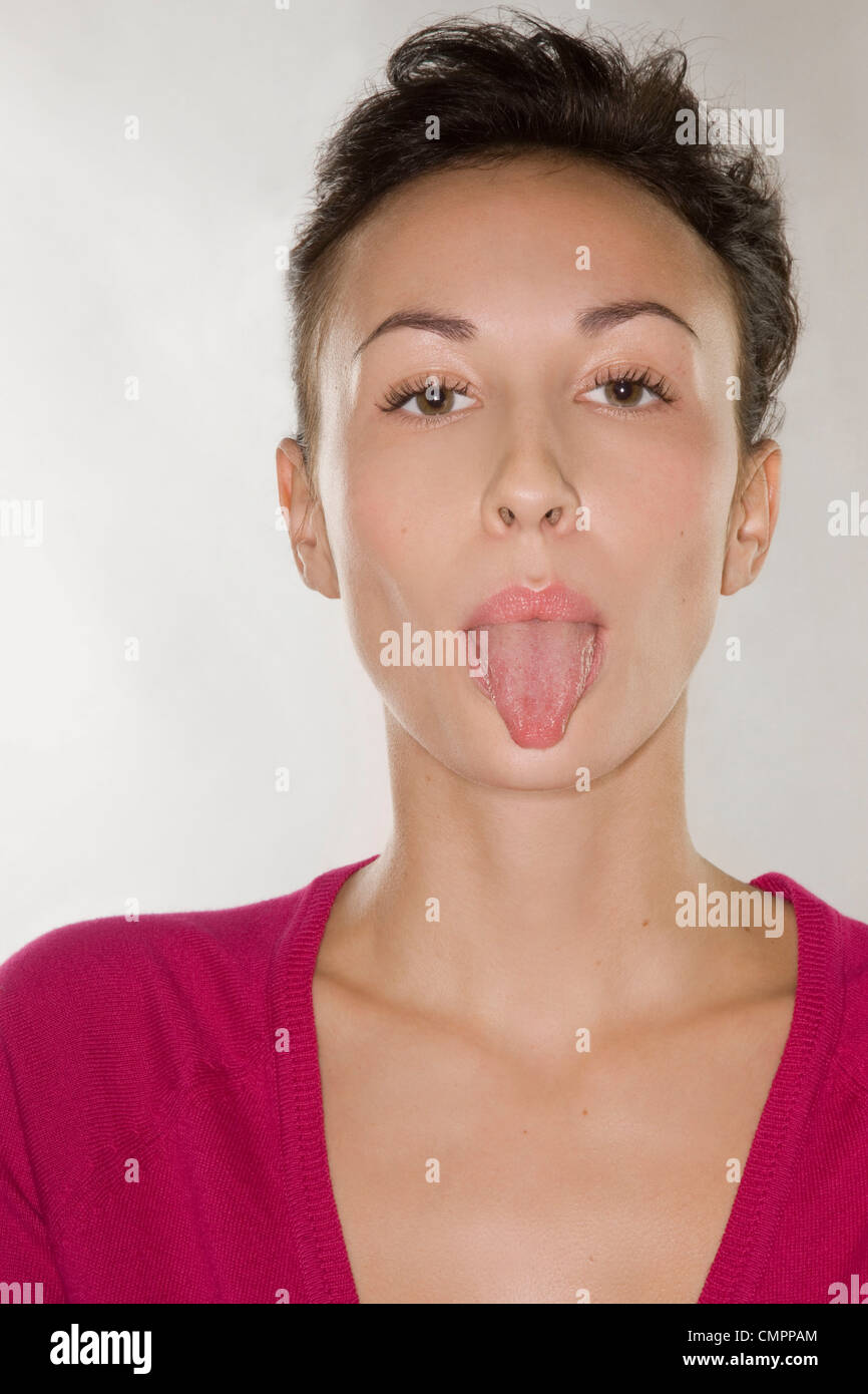 Girl poking out tongue hi-res stock photography and images - Alamy