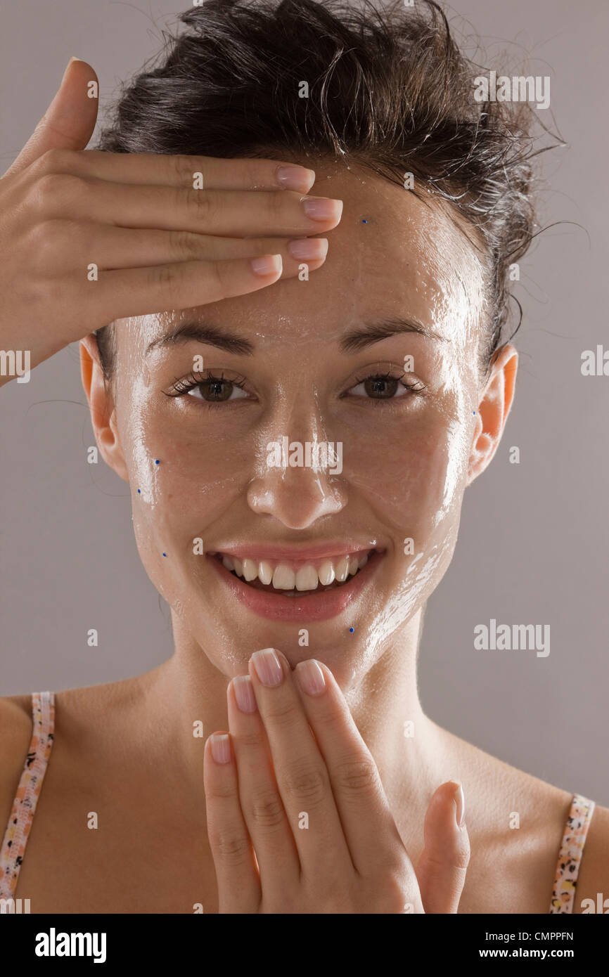 Woman peeling face Stock Photo - Alamy