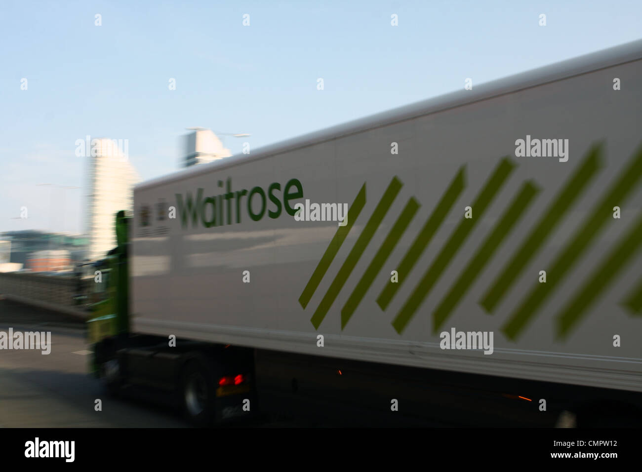 A Waitrose truck traveling along a road in London Stock Photo - Alamy
