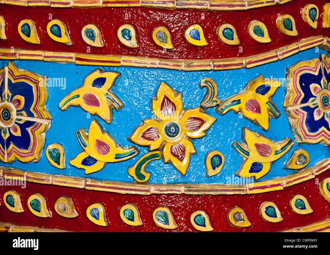 Native art carved on the wall in the temple Stock Photo - Alamy