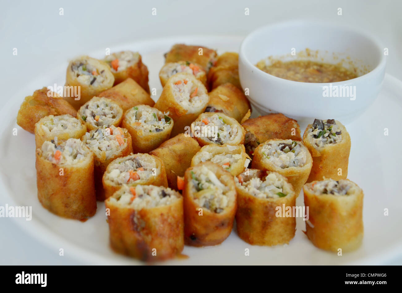 Chinese spring rolls on plate served with sweet sauce Stock Photo - Alamy