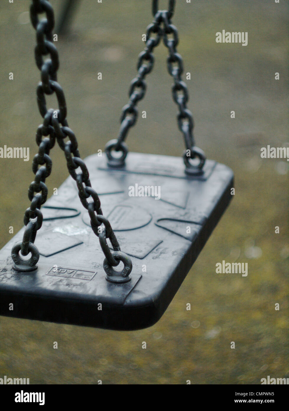 child`s swing seat in playground close up Stock Photo - Alamy