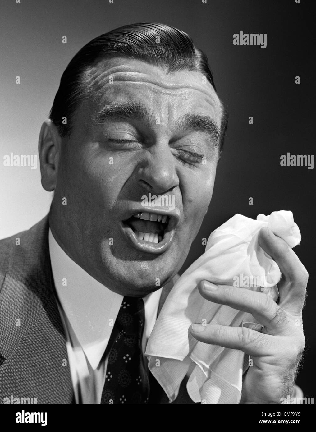 1950s PORTRAIT OF MAN ABOUT TO SNEEZE MOVING HANDKERCHIEF TOWARD FACE ...