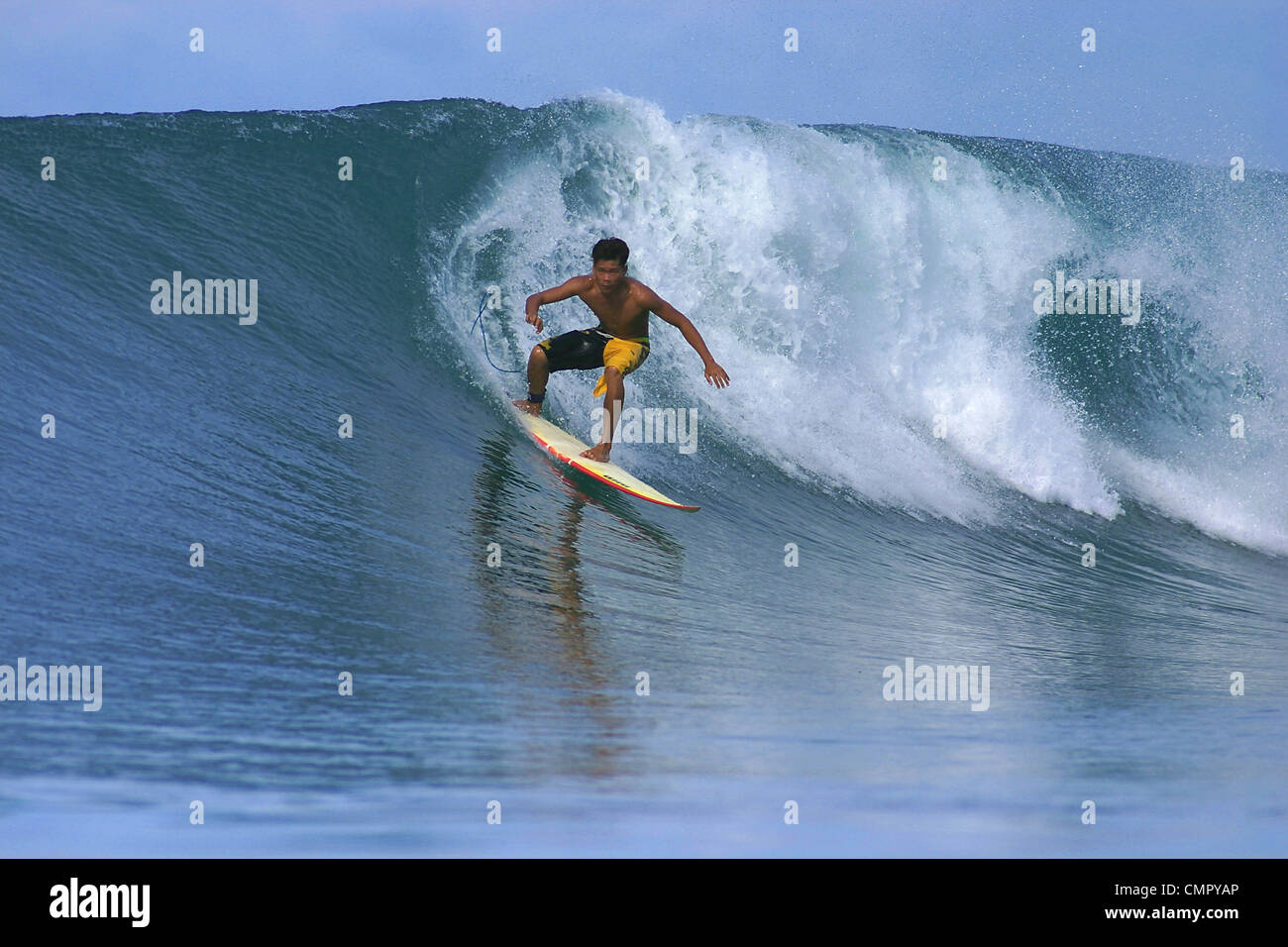 Surfing at Lagundri Bay on Nias Island, Sumatra, Indonesia Stock Photo ...