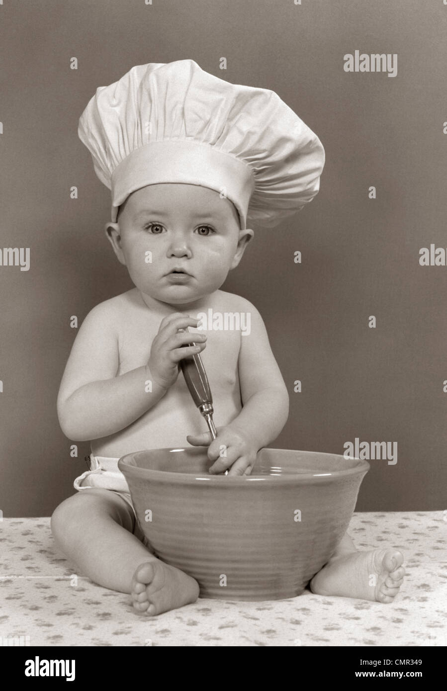 1940s 1950s BABY COOK WITH CHEF HAT SPOON MIXING BOWL STARING STRAIGHT ...