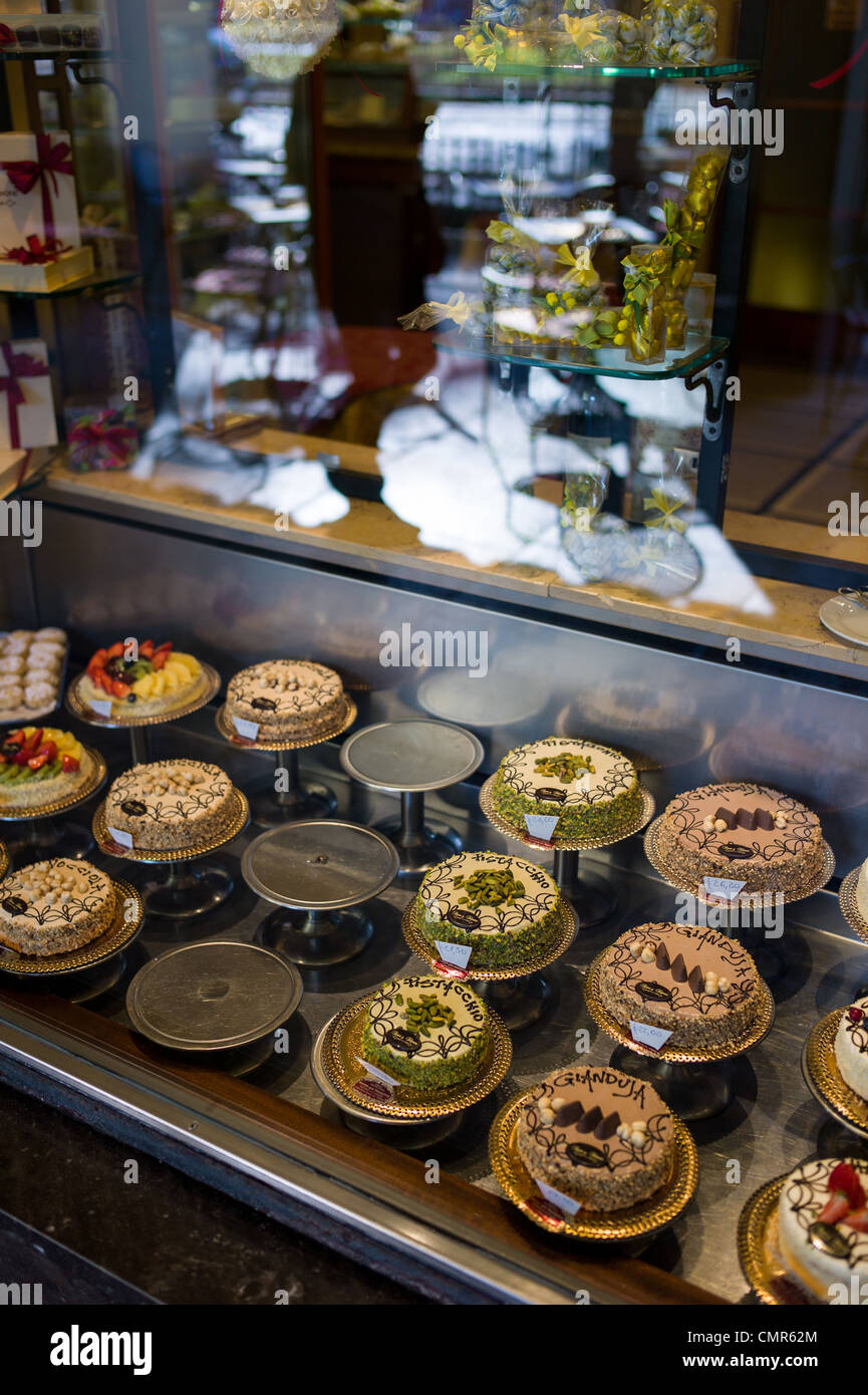 Delicious and tempting cakes on display in an Italian bakery shop ...