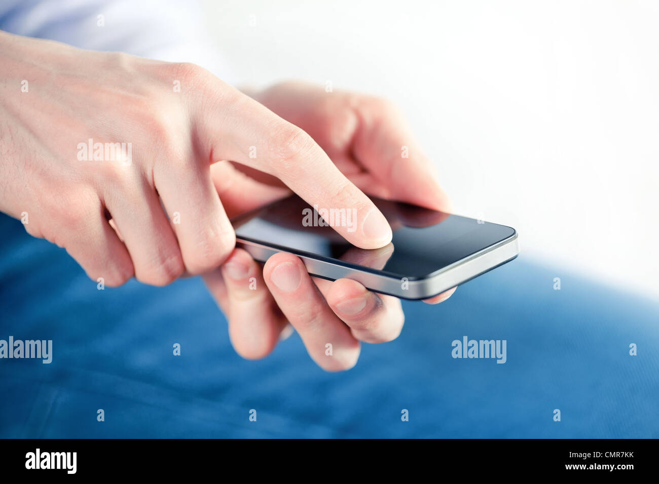 Man hand touching screen on modern mobile smart phone. Close-up image ...