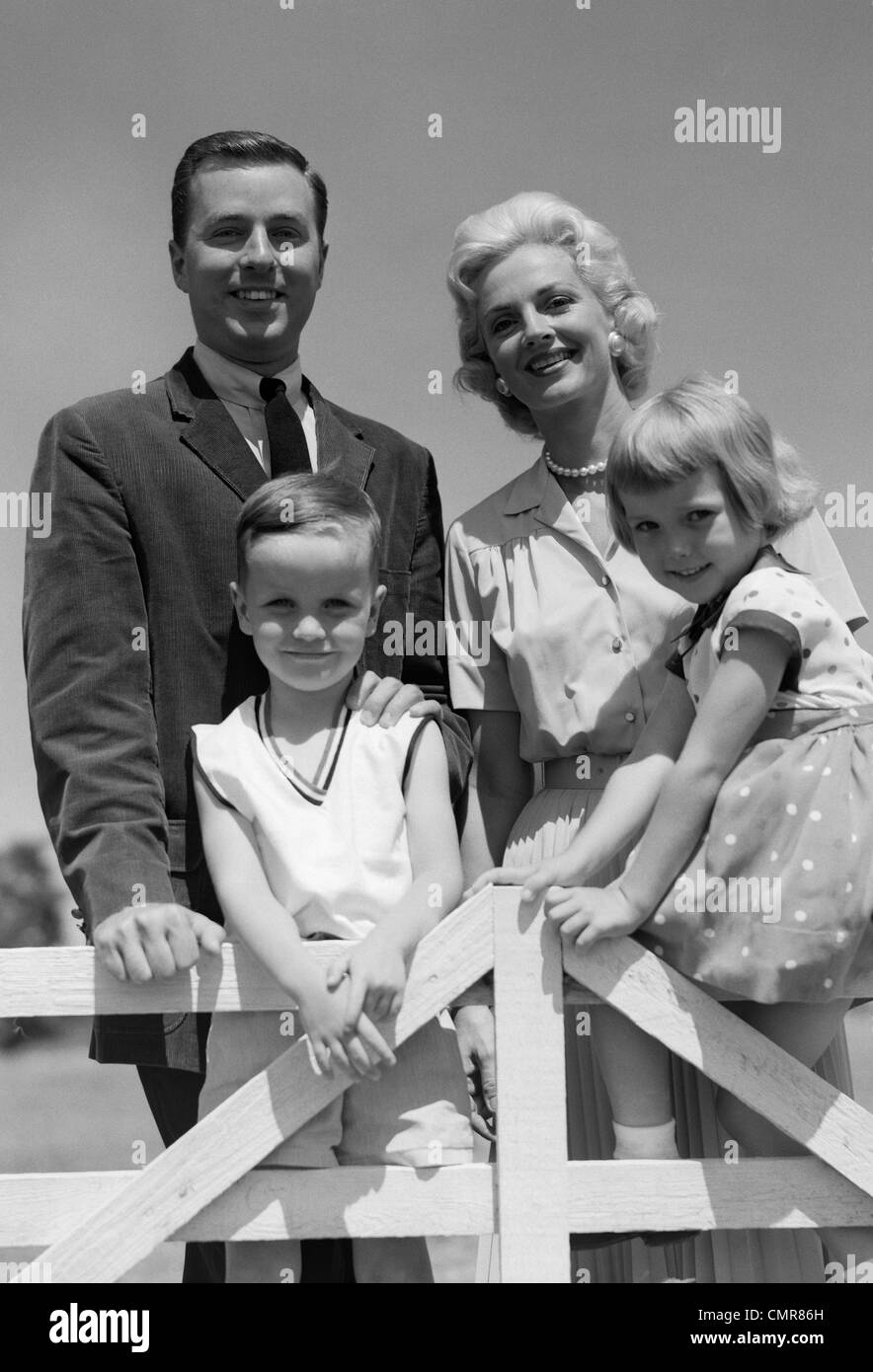 1950s 1960s PORTRAIT SMILING FAMILY FATHER MOTHER SON DAUGHTER BEHIND ...