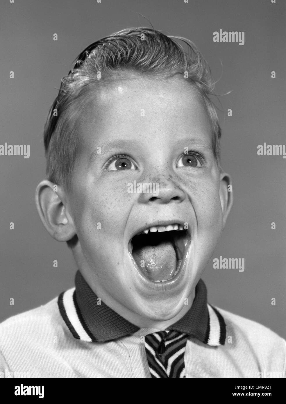 Boy with mouth wide open Black and White Stock Photos & Images - Alamy