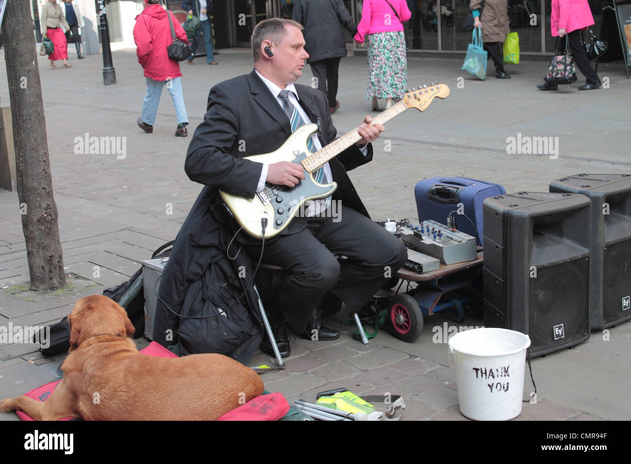 Blind busker with dog in Manchester Stock Photo - Alamy