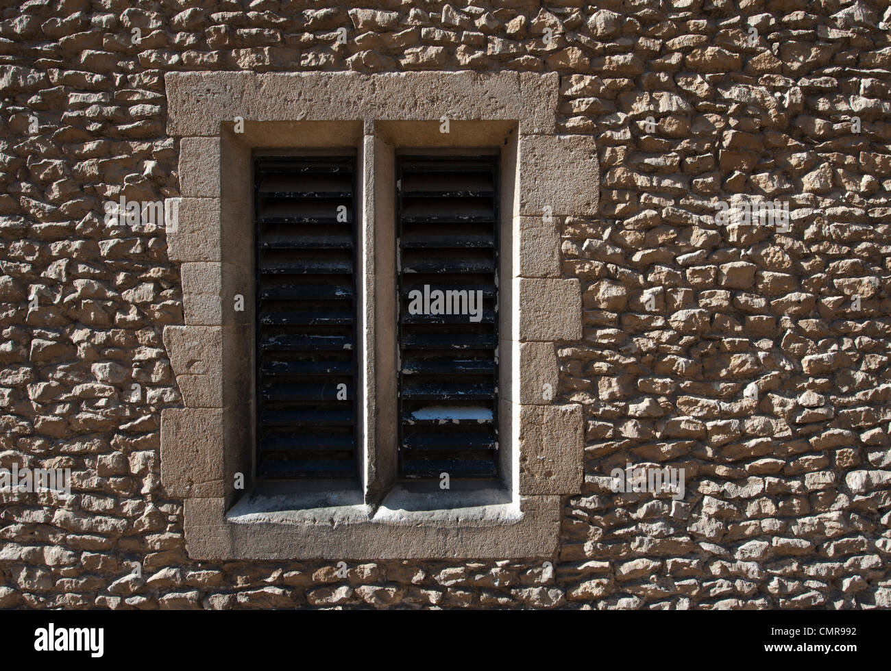 Stone wall and window on old college wall In Cambridge University UK at ...