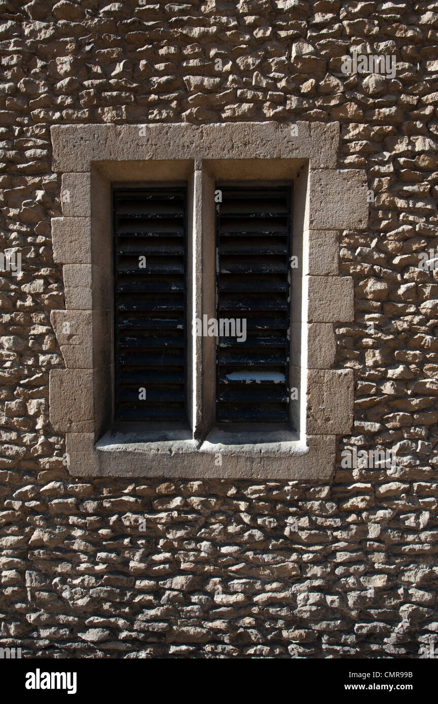 Stone wall and window on old college wall In Cambridge University UK at ...
