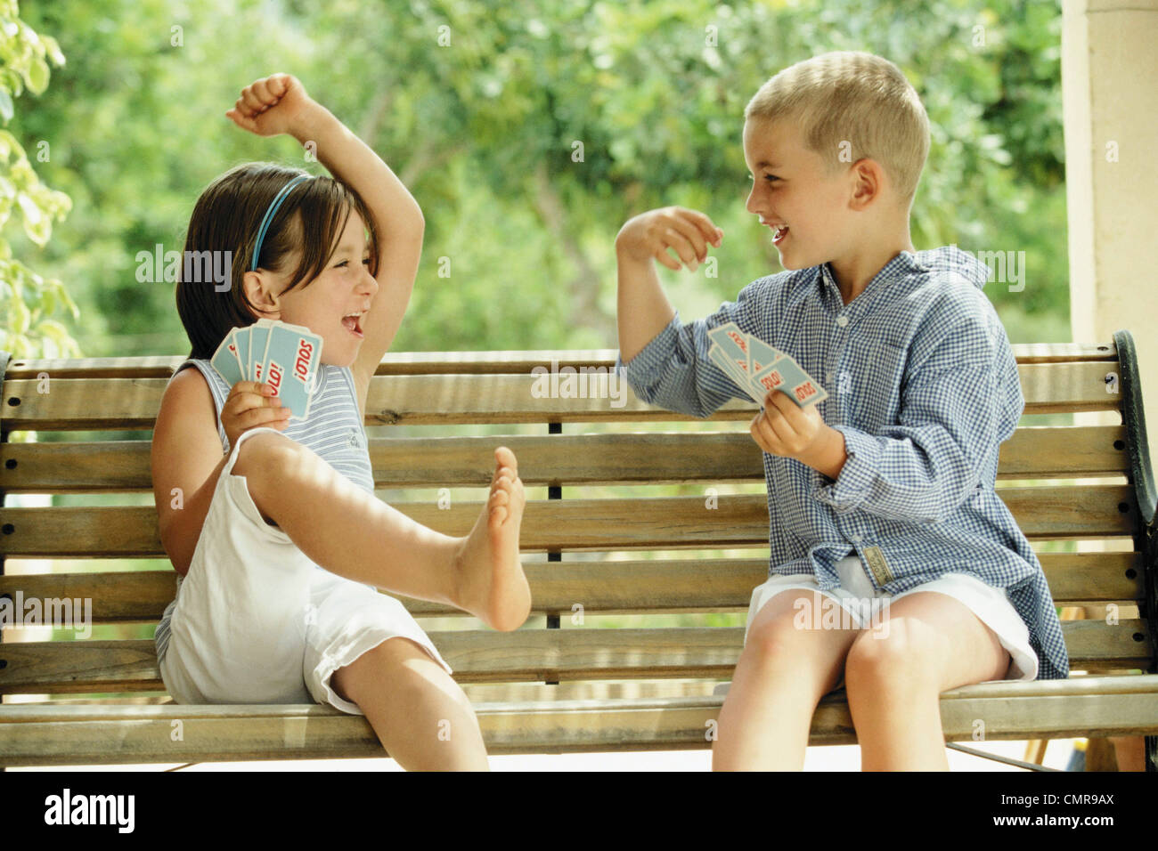 Children playing cards Stock Photo - Alamy
