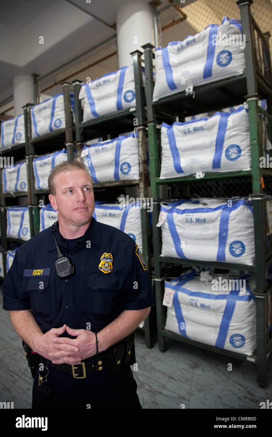 Denver, Colorado - Guard Mark Moody watches over bags of finished coins ...