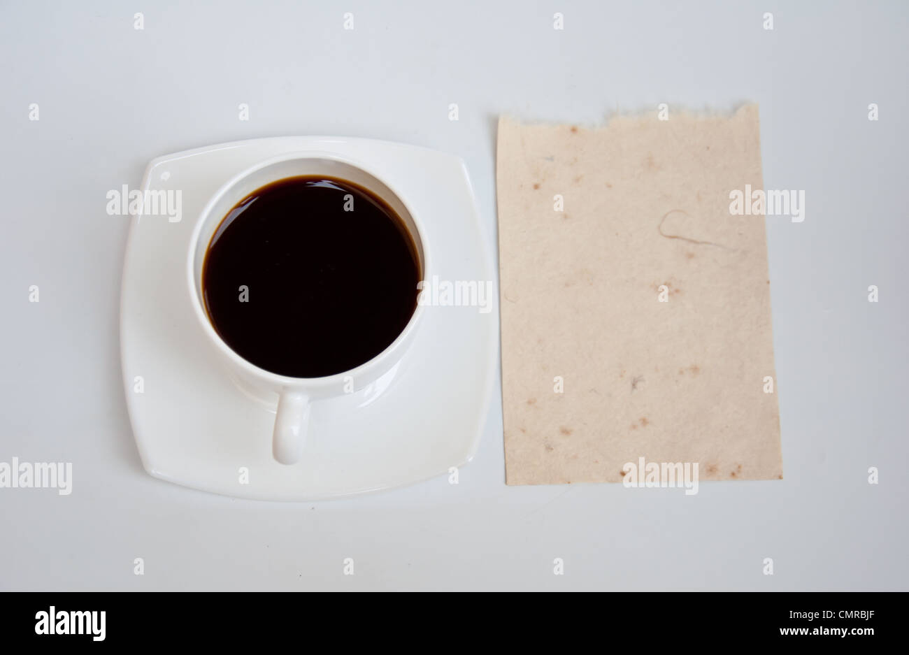 Blank paper and black coffee on white background Stock Photo - Alamy