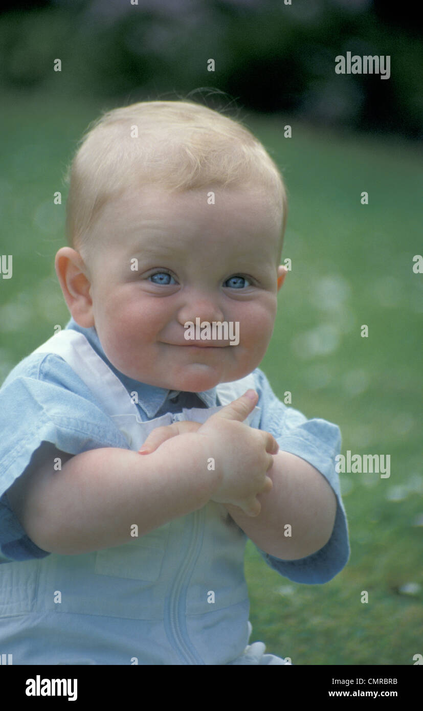 cute baby with cheeky expression Stock Photo - Alamy