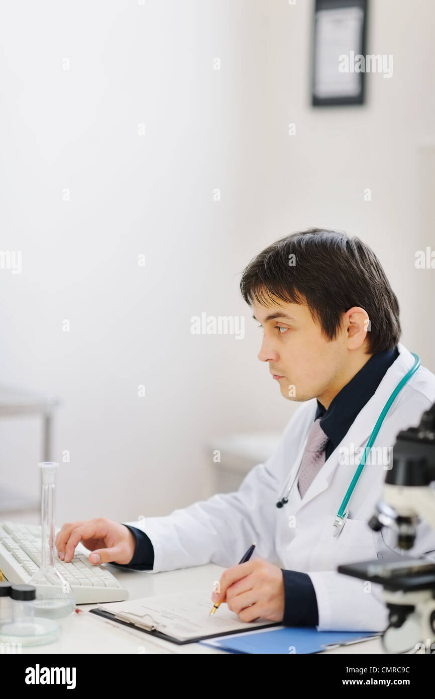 Medical doctor working at laboratory Stock Photo - Alamy