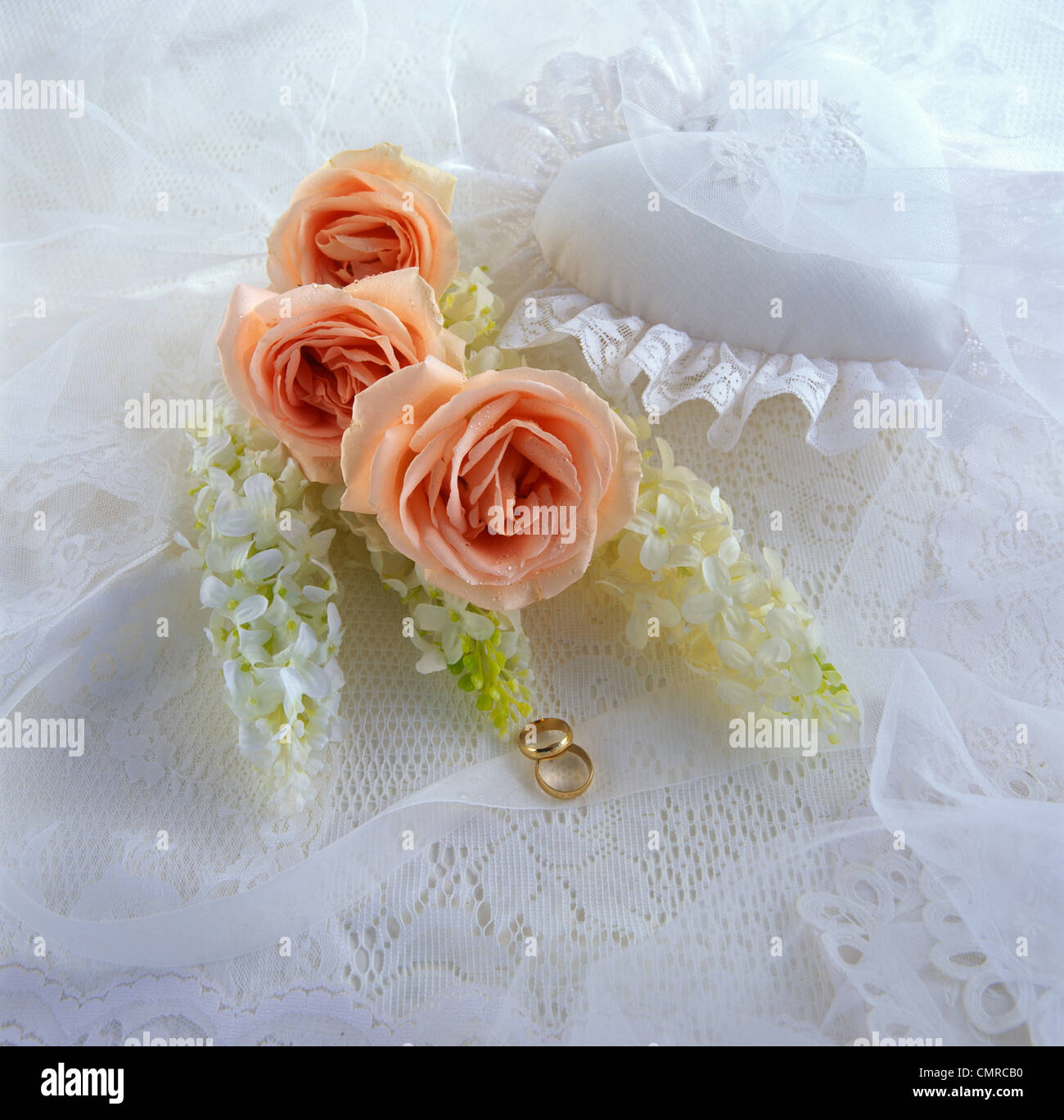 1990s BRIDAL STILL LIFE WITH BOUQUET AND RINGS ON LACE BACKGROUND Stock ...